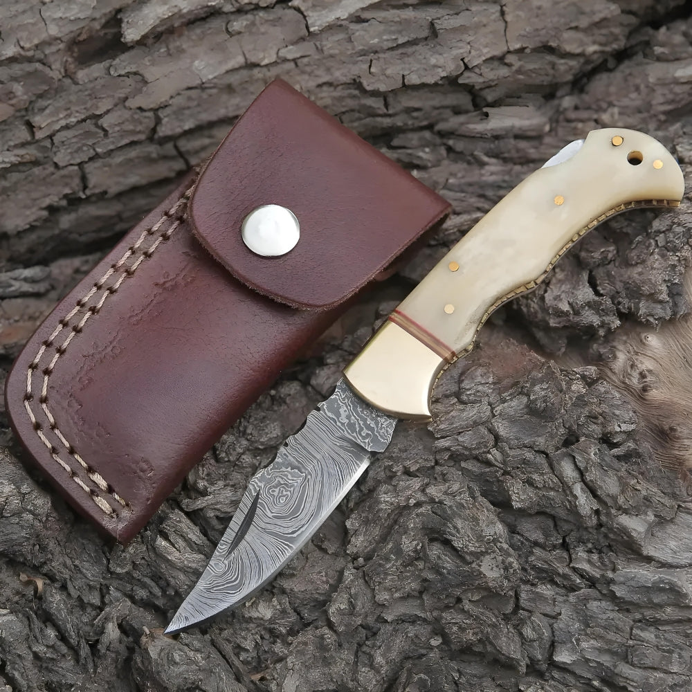 Skeletal Saber - Custom Hand Forged Damascus Folding Knife Engraved Br ...