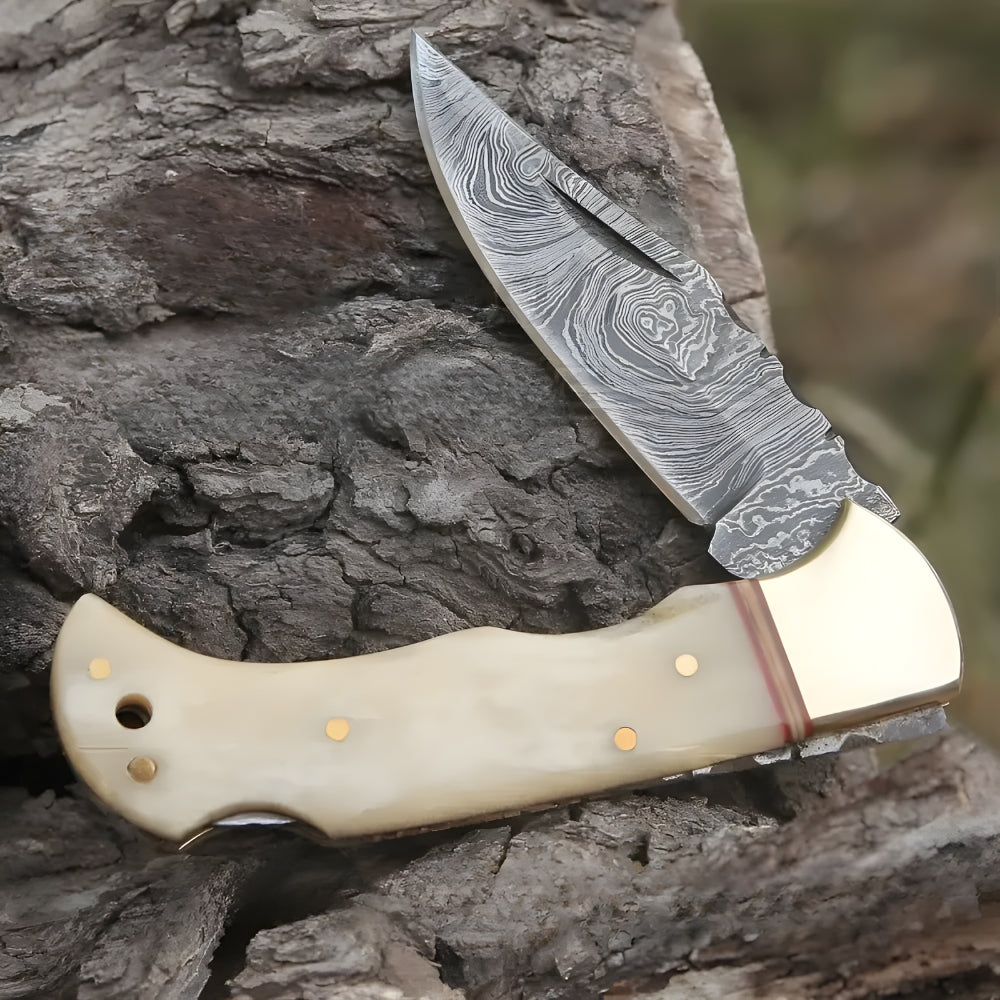 Skeletal Saber - Custom Hand Forged Damascus Folding Knife Engraved Br ...
